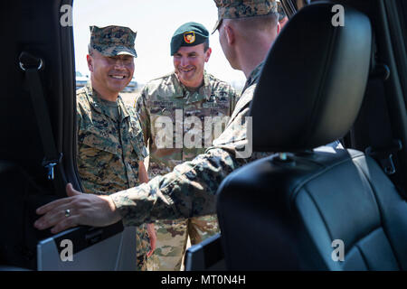 A Marine raider with 1st Marine Raider Battalion gives coordinates for ...