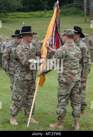 Incoming Commander Lt. Col. Kevin Black accepts the guidon from ...