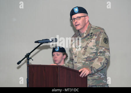 Out-going Commander, LTC Steven Baty (left), hands the battalion flag ...