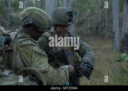 QUEENSLAND, Australia – U.S. Marine Capt. Thomas Schueman (left ...