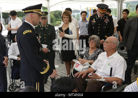 Task Force Smith’s war veteran places one flower on the memorial at the ...