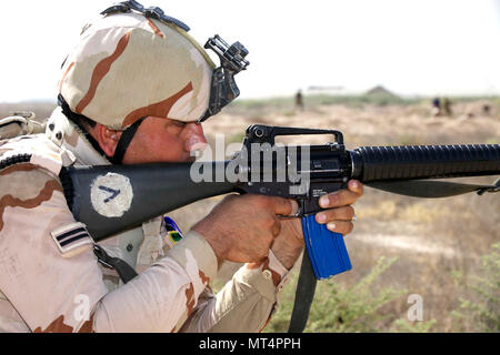 An Iraqi army soldier aims down the sights of his M16 rifle during ...