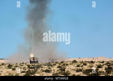 A mine clearing line charge (MCLIC) fired by U.S. Marine Corps M1 ...