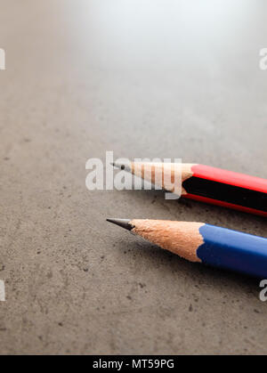 Two pencils on a desk Stock Photo - Alamy