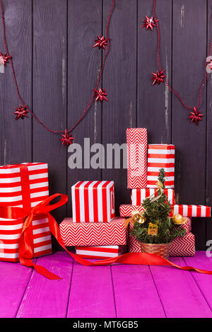 Many small green gift boxes on texture background of fashion trendy ...