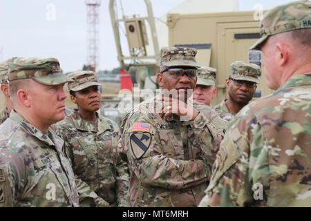 Brig. Gen. Douglas McBride, center, commanding general of the 13th ...