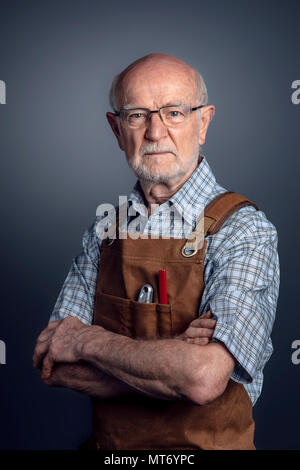 portrait of caucasian old carpenter studio shot Stock Photo - Alamy