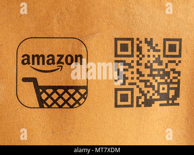 Detail of Amazon parcel showing logo bar code and QR code Stock Photo ...
