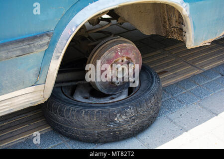 Car without tire need to be repaired Stock Photo - Alamy