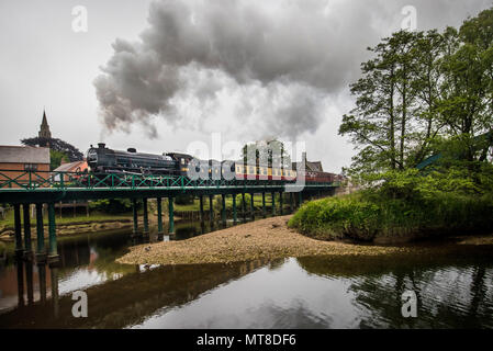 The LNER 1264 steam locomotive passes over the River Esk in Ruswarp on ...