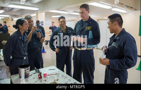 OCEAN (May 12, 2018) Capt. David Bretz, center right, mission commander ...