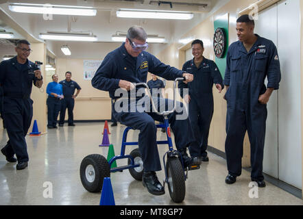 OCEAN (May 12, 2018) Capt. David Bretz, center right, mission commander ...