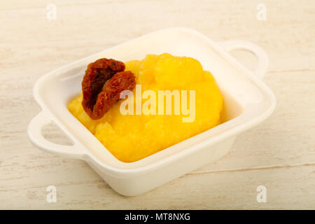 Polenta with dry tomato Stock Photo - Alamy