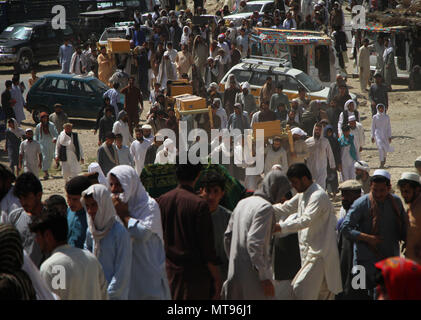 Relatives of nine victims killed in a bank robbery mourn outside the ...