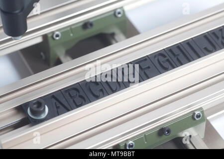 Engraving device pantograph with letterpress alphabet Stock Photo - Alamy