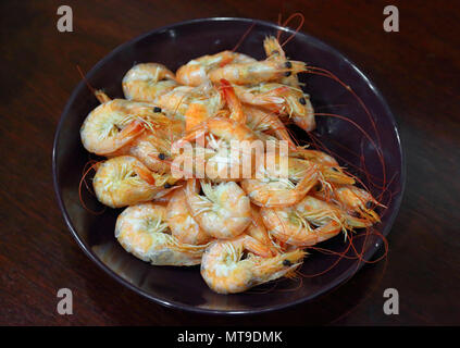 Boiled tiger prawns in the bowl for snack Stock Photo - Alamy