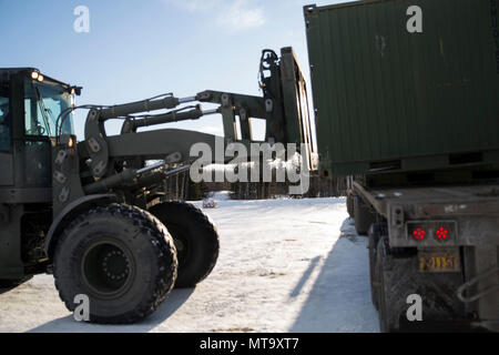 A Marine with Combat Logistics Regiment 25 moves a quadcon full of ...