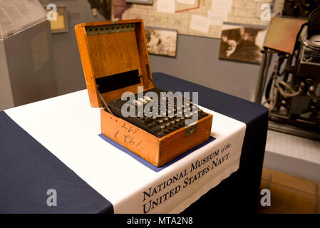 An Enigma machine rotor on display showing the internal wiring in ...