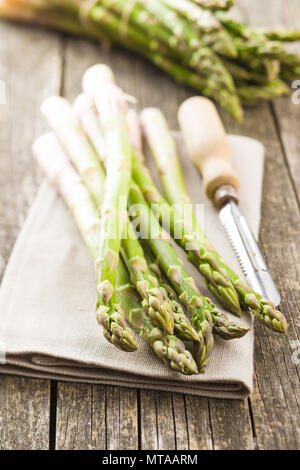 Fresh green asparagus on old oak table Stock Photo - Alamy