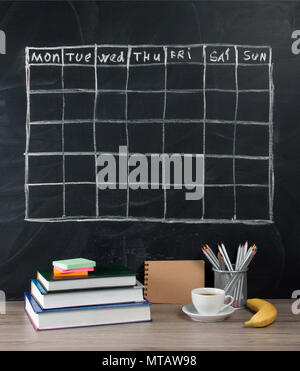 Grid timetable schedule on black chalkboard background Stock Photo - Alamy