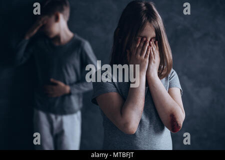 Family violence. Child abuse. Sad child with bruises under his eyes and ...