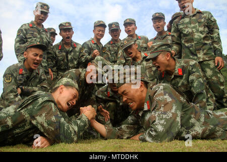 Chongzuo, China. 29th May, 2018. Armed police receive strict military ...