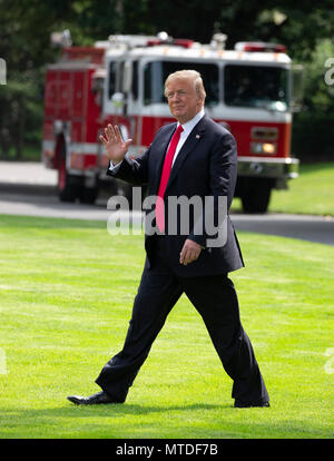 President Donald Trump waves as he departs after speaking at the "March ...