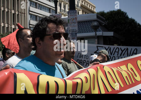A protester seen shouting slogans while holding a flag during the ...