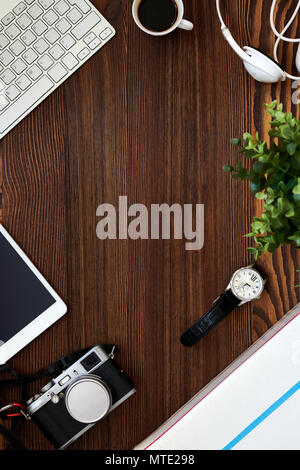 Photography hipster work table set with computer, tablet, film, lenses ...