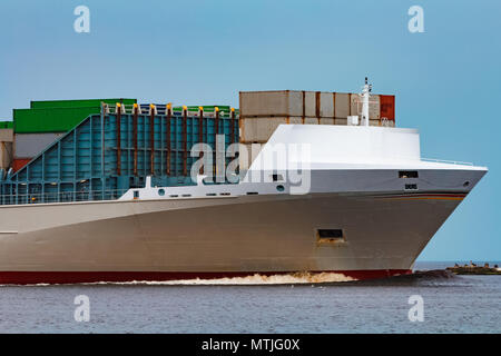 Grey container ship. Logistics and production import Stock Photo - Alamy