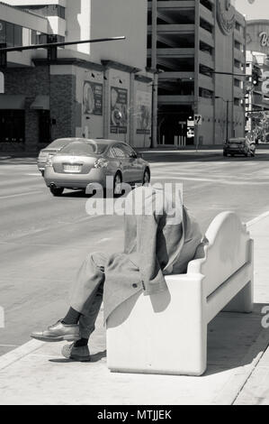 Vegas - tramp on bench with coat on head Stock Photo - Alamy