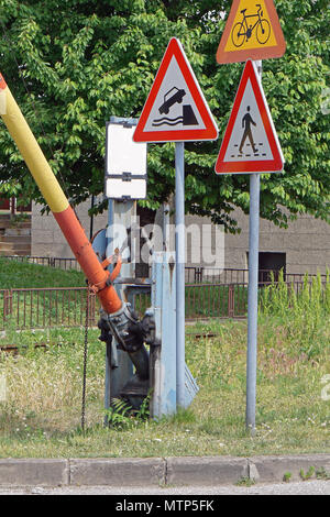 Various traffic signs caution warnings and ramp Stock Photo - Alamy