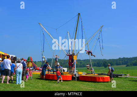 Children bungee jumping at the annual Sherborne Castle Country Fair ...