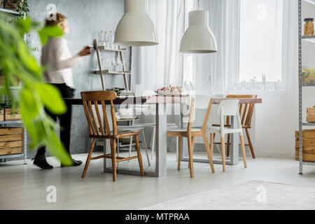 Dining room with table for big family Stock Photo - Alamy