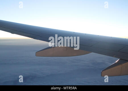 Westjet airplane wing photo taken from a passenger window Stock Photo ...