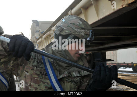 A M1078 LMTV light utility truck is loaded into a C-17 Aircraft Static ...