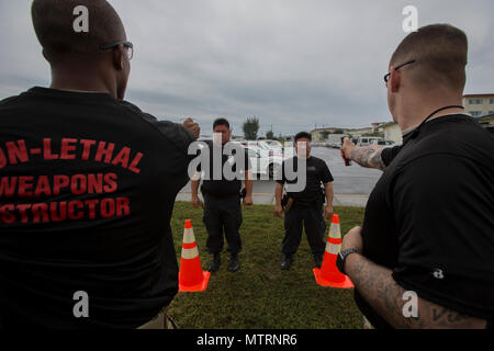 Non-Lethal Weapons Intructors spray oleoresin capsaicin (OC) at Japanese Security Guards ...