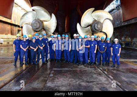 Crewmembers of the Coast Guard Cutter Waesche stand under the ...