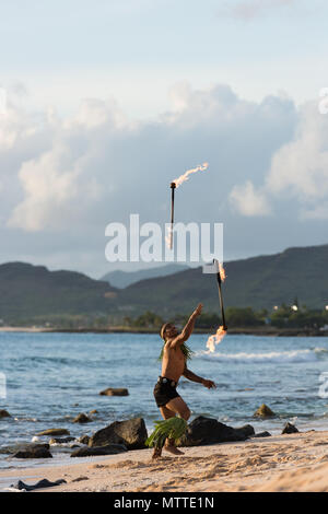 Male fire dancer performing with fire levi sticks Stock Photo - Alamy