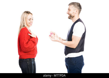 White man making proposal to his girlfriend with engagement ring ...