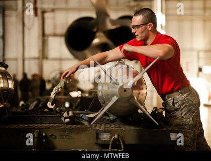 Airman 1st Class Connor Howard removes a bomb fuze initiator (FZU-55 ...