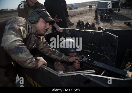 An Iraqi Counter-Terrorism Service instructor demonstrates how to ...