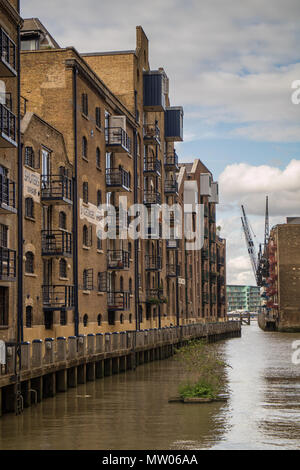 Old warehouses converted into flats and apartments on the River Thames ...