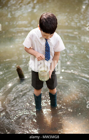 Kid with a jar of jam Stock Photo - Alamy