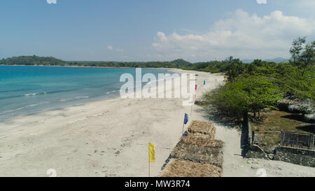 Beautiful tropical beach Cabugao with white sand and palm trees in the ...