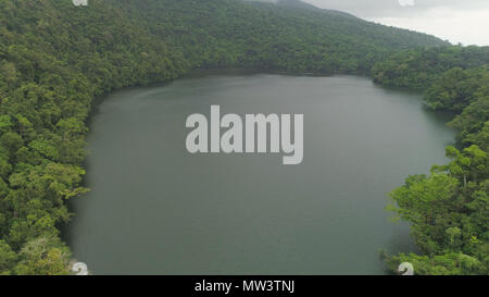 Aerial view of lake Bulusan in the mountains with green rain forest ...