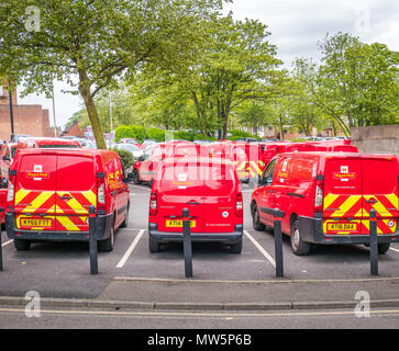 Royal Mail Group red delivery van and post man. England, UK. Concept ...