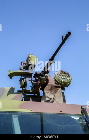 Machine gun integrated on military vehicle. Combat vehicle with HMG ...