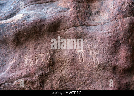 Ancient Nabatean and Thamudic inscriptions on rock representing camel ...