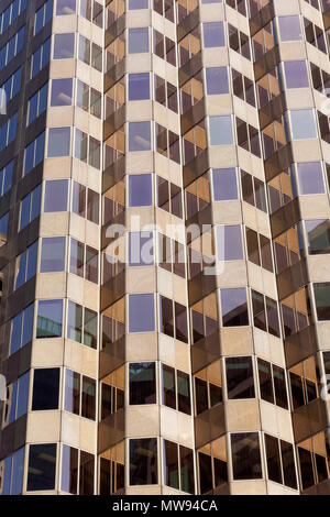 Rectangular windows of a high rise office building forming a repetitive ...